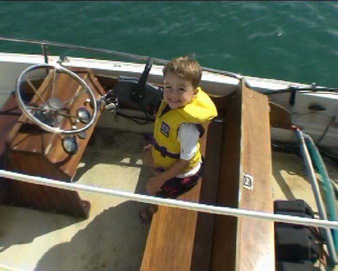 kids at play: pj getting ready to drive the whaler 2